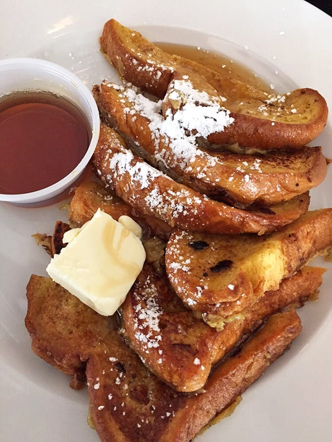 This French toast doesn't just say "good morning"—it serenades you with cinnamon-kissed perfection and a puddle of pure maple goodness.
