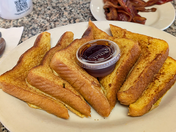 French toast so thick and golden, it could double as a foundation for a small house.