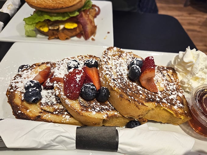 French toast that makes you question every other breakfast you've ever had. Those berries aren't just garnish—they're supporting actors in a culinary masterpiece.