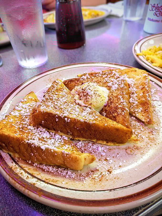 This French toast doesn't just wear its powdered sugar and cinnamon like makeup—it wears it like a medal of honor.