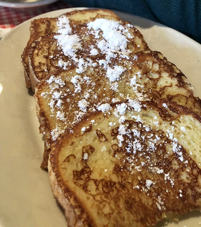 French toast that's dressed for success with a dusting of powdered sugar—like breakfast wearing its Sunday best.