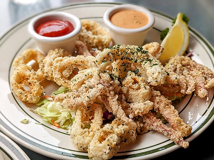 Fried calamari that achieves the impossible – crispy exterior, tender interior, and not a hint of rubber tire texture that plagues lesser versions.
