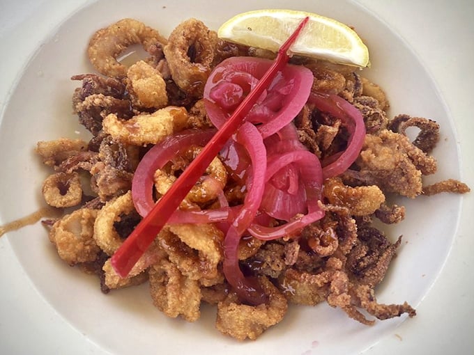 Fried calamari with pickled onions – crispy, tender rings of joy that disappear faster than you can say "one more order, please."