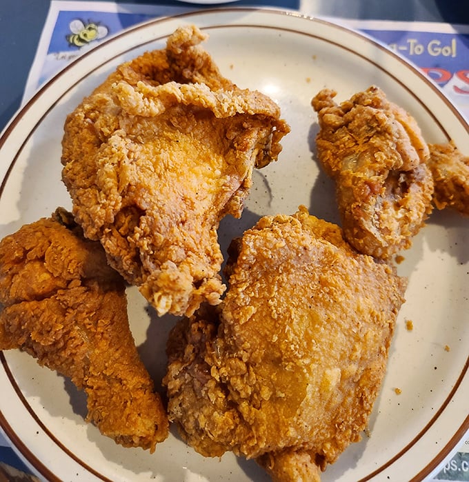 Fried chicken that would make Colonel Sanders question his life choices—golden, crispy, and unapologetically old-school delicious.