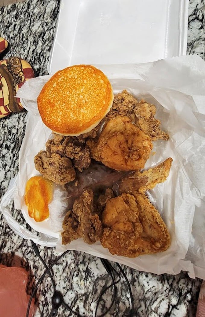 Fried chicken and a golden biscuit—the kind of to-go order that rarely makes it all the way home before being devoured.
