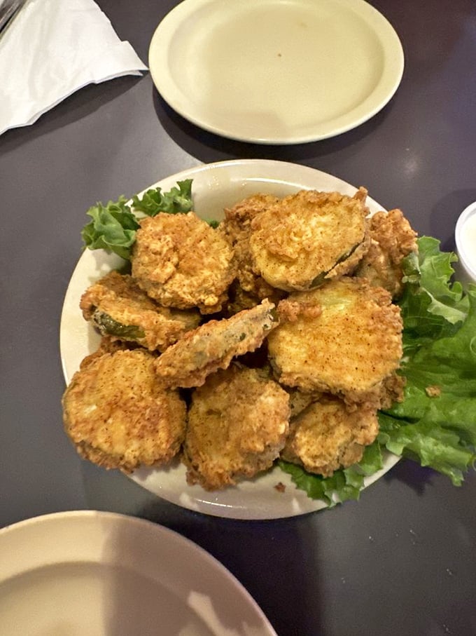 Golden-fried pickle chips that shatter with each bite – the perfect tangy counterpoint to a hearty burger.