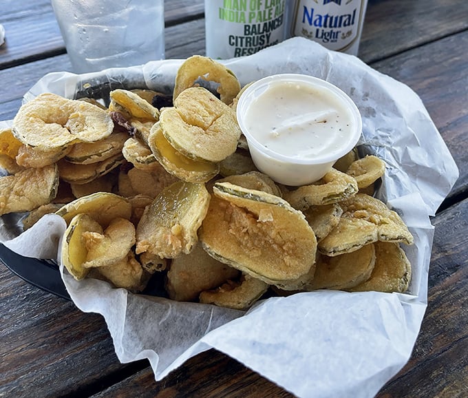 Crispy, golden fried pickles that snap with tangy brine beneath their crunchy coating—the perfect sidekick to smoky barbecue and cold beer.