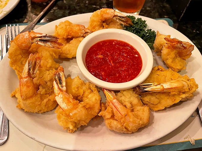 Golden-fried jumbo shrimp that crunch like nature's perfect potato chip, served with a sauce that demands to be the center of attention.