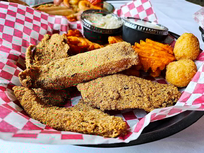 Cornmeal-crusted fillets with that perfect crunch factor—the kind of fried fish that makes you wonder why you'd eat it any other way.