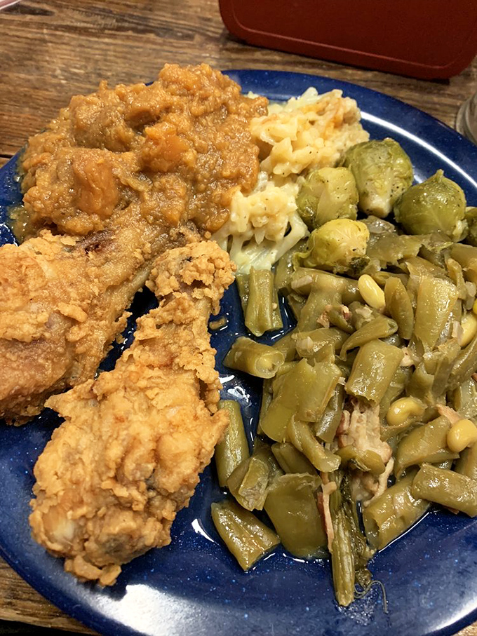 This plate tells the story of the South—crispy fried chicken, tender green beans cooked low and slow, and mac and cheese that could solve world peace.