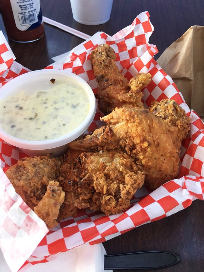 Golden cornbread crowning a feast of perfectly seasoned fried chicken and beans—proof that simple food done right is the highest form of culinary art.