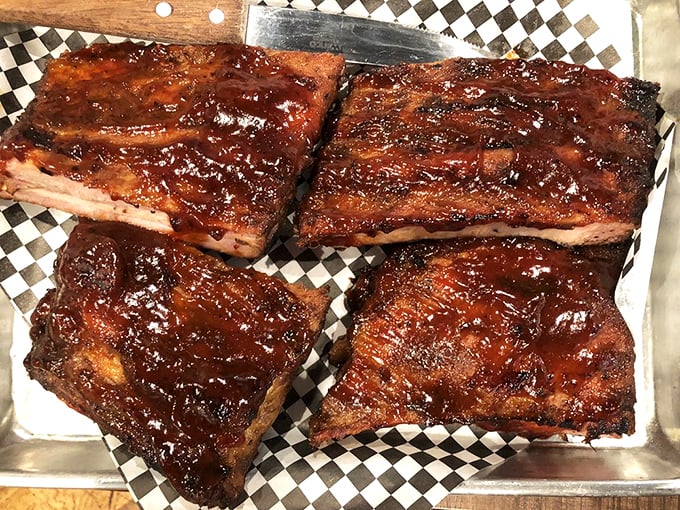 These ribs don't just fall off the bone—they practically leap onto your plate with a glossy coat of sauce that's the perfect balance of sweet and tang. 