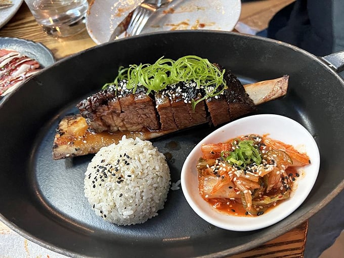 The Korean short rib arrives like edible art—tender meat, perfect rice, and kimchi creating a harmony that makes your taste buds sing.