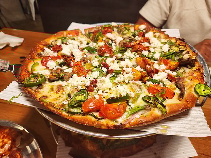 Fresh vegetables dancing atop a golden crust with feta cheese playing the starring role—proof that vegetarian pizzas can steal the show.