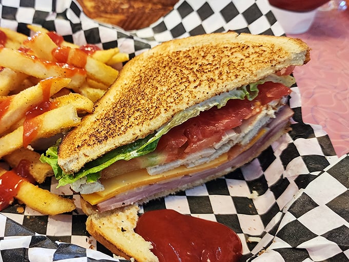 This grilled cheese sandwich isn't playing around – golden-brown bread housing a multilayered masterpiece that makes your childhood version look like amateur hour.