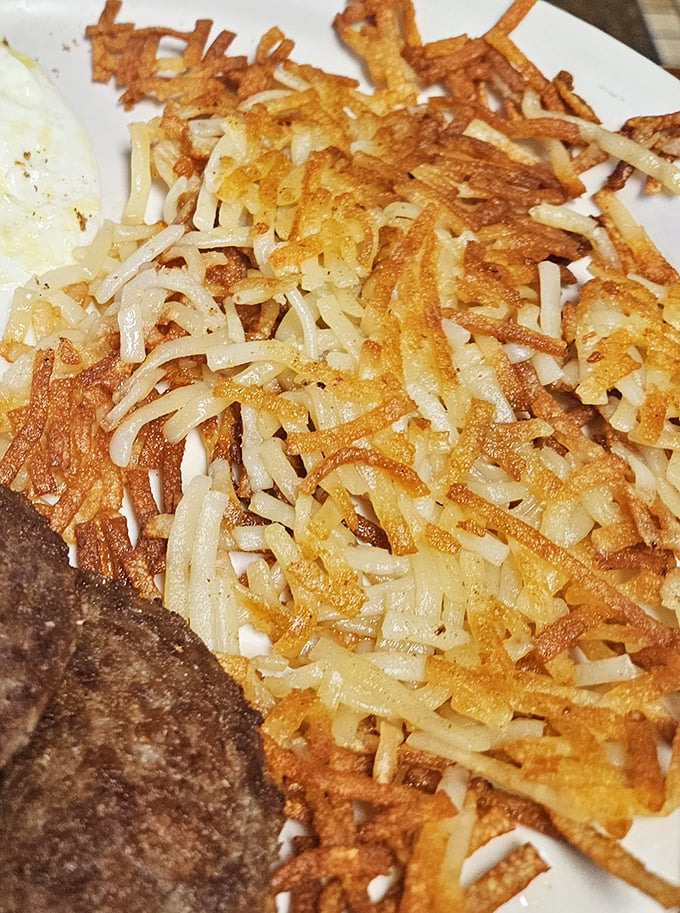 These aren't just hash browns—they're a crispy, golden tapestry of potato artistry that makes you wonder why anyone bothers with fancy breakfast sides.