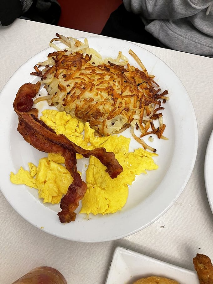 Crispy hash browns, fluffy eggs, and bacon that stands at attention—the breakfast trifecta that makes mornings worth facing.