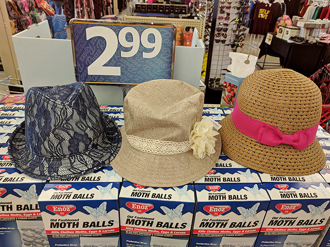 Summer-ready headwear displayed atop boxes of moth balls—a retail juxtaposition that somehow makes perfect sense in the wonderful world of Roses.