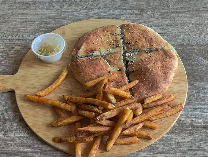 Here's your hawawshi served proper style - crispy, golden, and accompanied by perfectly seasoned fries.