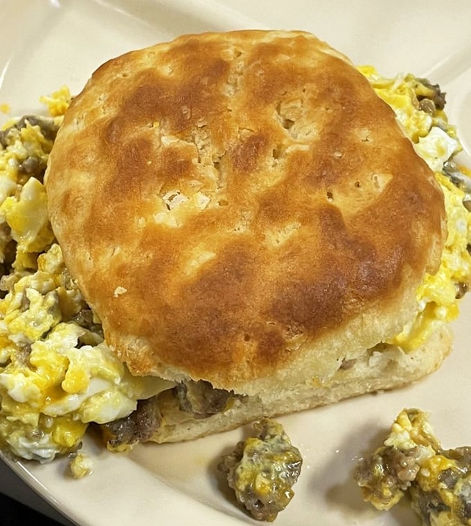 The breakfast sandwich that launched a thousand food pilgrimages – a fluffy biscuit cradling eggs and sausage in perfect harmony.