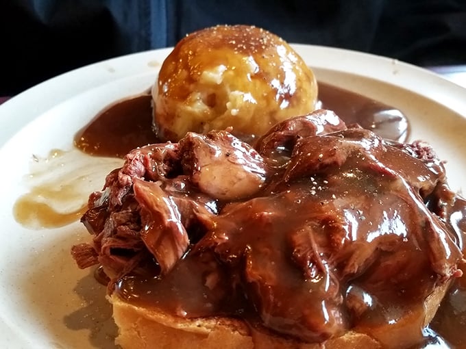 Hot beef sandwich—the Midwest's answer to French dip—swimming in gravy with a golden dumpling island that's worth the journey alone.