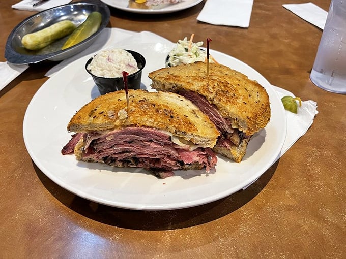 Hot pastrami stacked higher than your weekend to-do list, with a side of coleslaw that's actually worth eating. This is commitment on a plate.