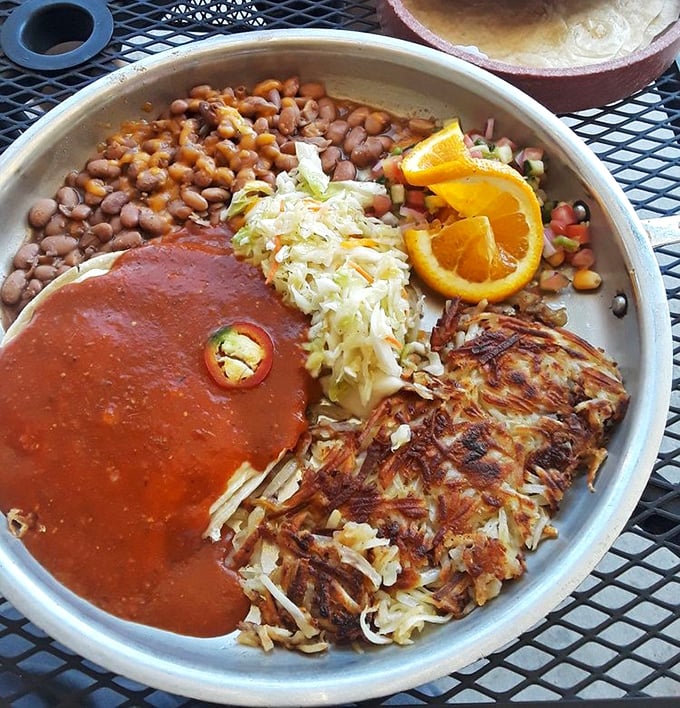 A fiesta on a plate—crispy hash browns, vibrant sauce, and beans create a breakfast worth crossing borders for.