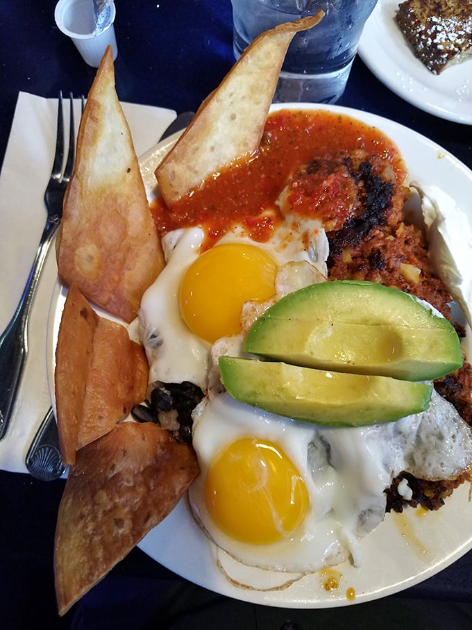 Breakfast with attitude—eggs, corned beef hash, avocado, and tortillas creating the morning alliance you didn't know you needed.