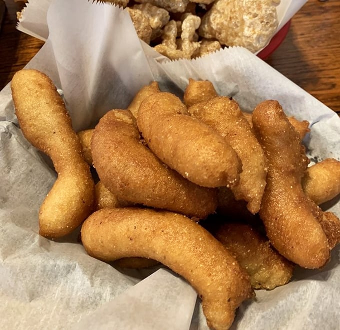 Hush puppies so perfectly golden they deserve their own trophy case—crispy exterior giving way to that steamy, tender cornmeal center.