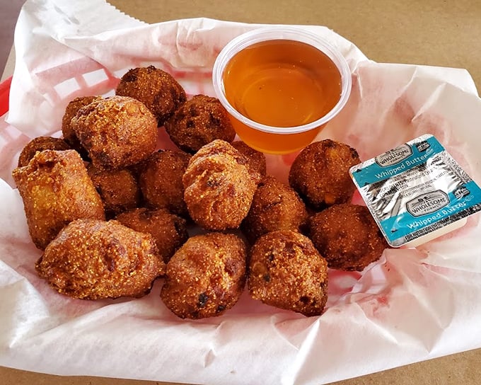 Hush puppies: the unsung heroes of any seafood feast. These golden orbs of cornmeal goodness are what angels would snack on if heaven had a fryer.