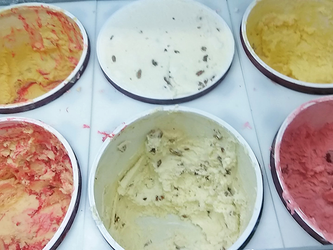 A rainbow of flavors awaits in these colorful containers—each one promising a different creamy adventure for your taste buds.