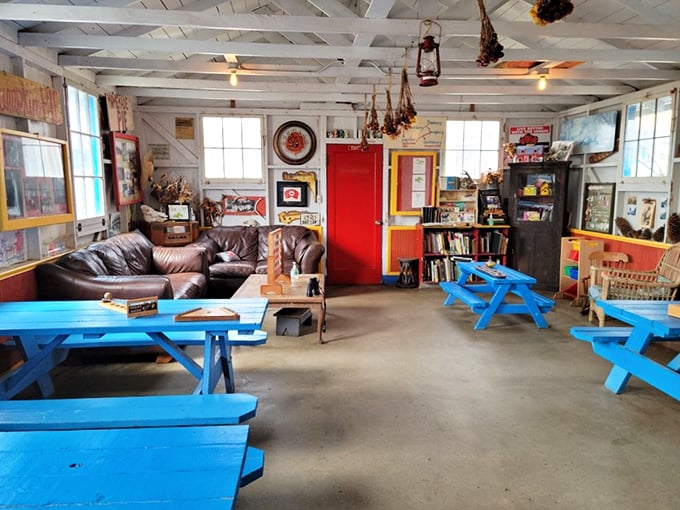 Board games, comfy couches, and blue picnic tables create a living room atmosphere where lingering is encouraged and berry-stained fingers are badges of honor.
