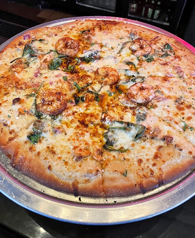 A pizza that would make even Jaws swim away satisfied. Those perfectly seasoned shrimp are the catch of the day!