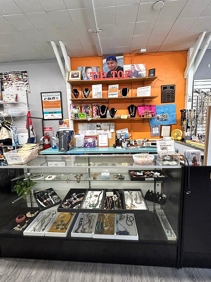 Behind the glass case, necklaces and bracelets await their second act, like supporting characters ready for a new starring role.