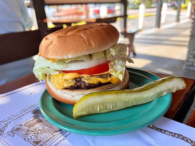 Behold the cheeseburger in paradise—no frills, no gimmicks, just honest-to-goodness beef with that subtle hint of fish-smoking magic in the background.