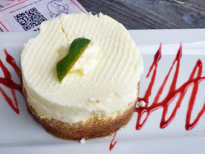 This key lime pie doesn't just end a meal – it's the grand finale that makes you wonder why you bothered with the opening acts.