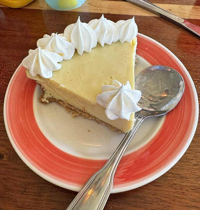 Key lime pie that strikes the perfect balance between tart and sweet—topped with whipped cream dollops like little meringue clouds.