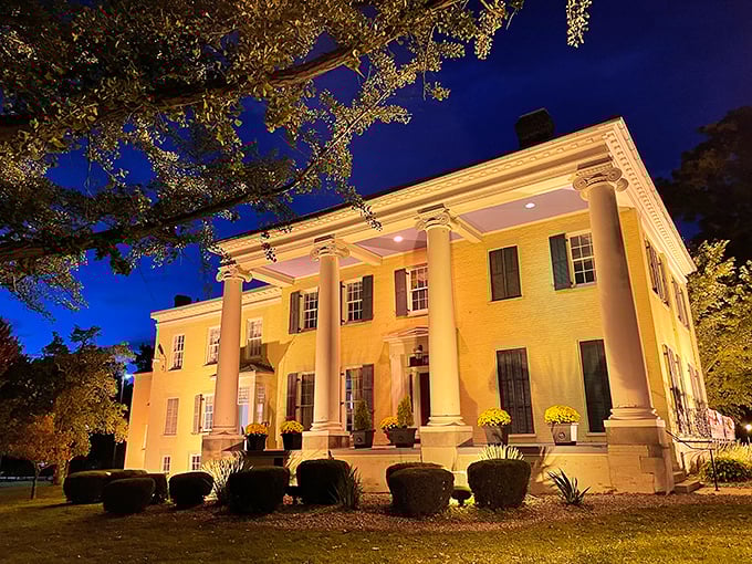 Elegant columns and warm lighting transform this historic Warren mansion after dark, proving affordable cities can still deliver moments of grandeur.