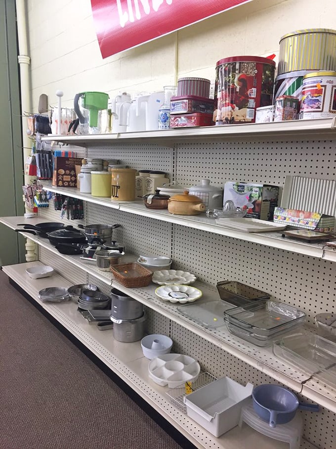 Kitchen treasures lined up like soldiers – cast iron veterans and Pyrex champions ready for deployment in your culinary adventures.