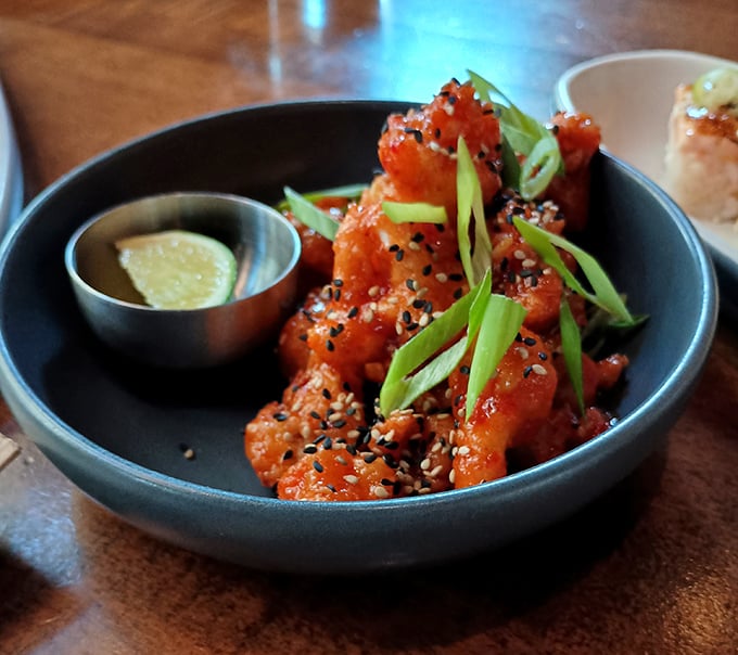 Korean fried cauliflower that might make you forget chicken wings exist—crispy, sticky, and sprinkled with enough sesame seeds to make you feel virtuous.
