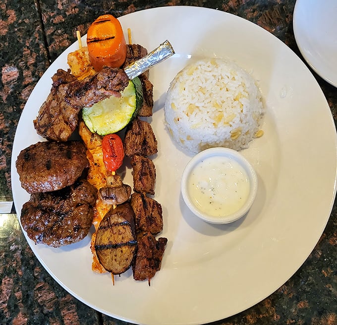 A carnivore's dream plate: perfectly grilled meats alongside colorful vegetables and fluffy rice. This isn't just dinner—it's a celebration on a plate.