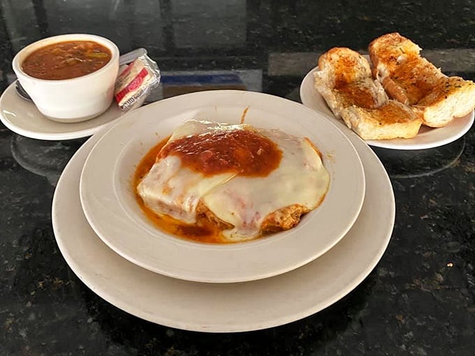 Not just food—it's edible architecture. Layers of cheese and sauce creating the Taj Mahal of comfort cuisine.