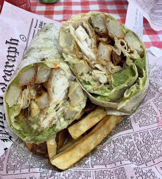 Fish and chips wrapped like a present in newspaper—the British tradition alive and well in Henderson. These flavor-packed bundles make the Queen's guards stand at attention.