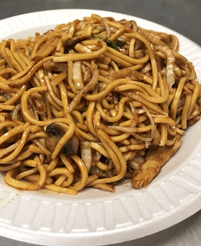 Lo mein that doesn't know the meaning of "clumpy" – each noodle distinct yet working in perfect harmony, like a well-rehearsed orchestra of carbs.