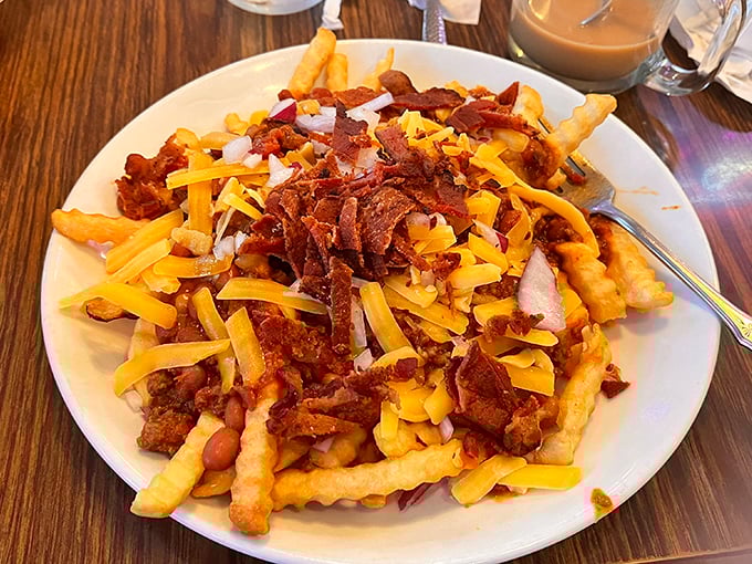 The holy grail of indulgence: Fins' loaded fries arrive as a mountain of potato, chili, cheese, bacon, and onion—a beautiful mess worth every napkin.