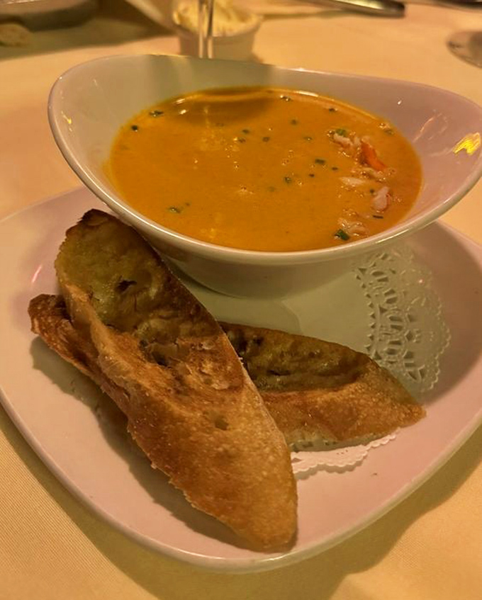 Golden bisque with crusty bread soldiers standing at attention – comfort food that went to finishing school.