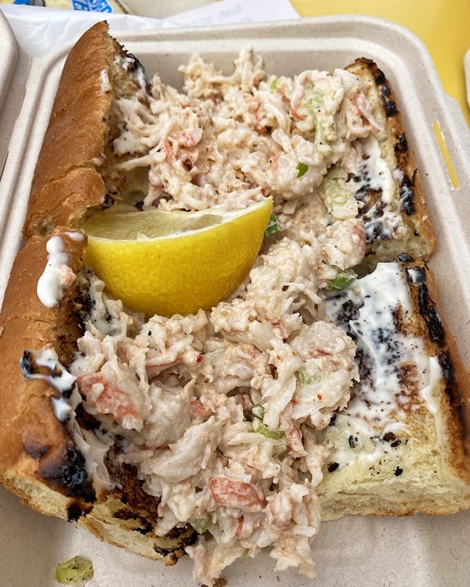 A seafood sandwich that makes you wonder why you'd ever order anything else—tender chunks of seafood nestled in toasted bread with a squeeze of lemon for that perfect zing.