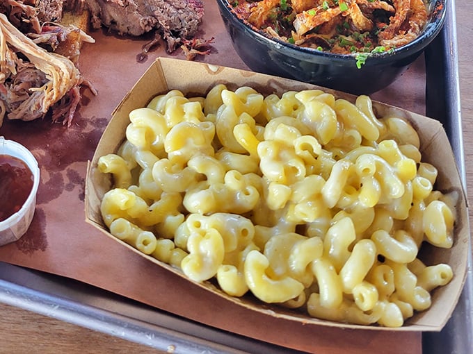 Mac and cheese that doesn't apologize for its simplicity – just perfectly cooked pasta swimming in a golden pool of cheese that whispers, "Dive in."