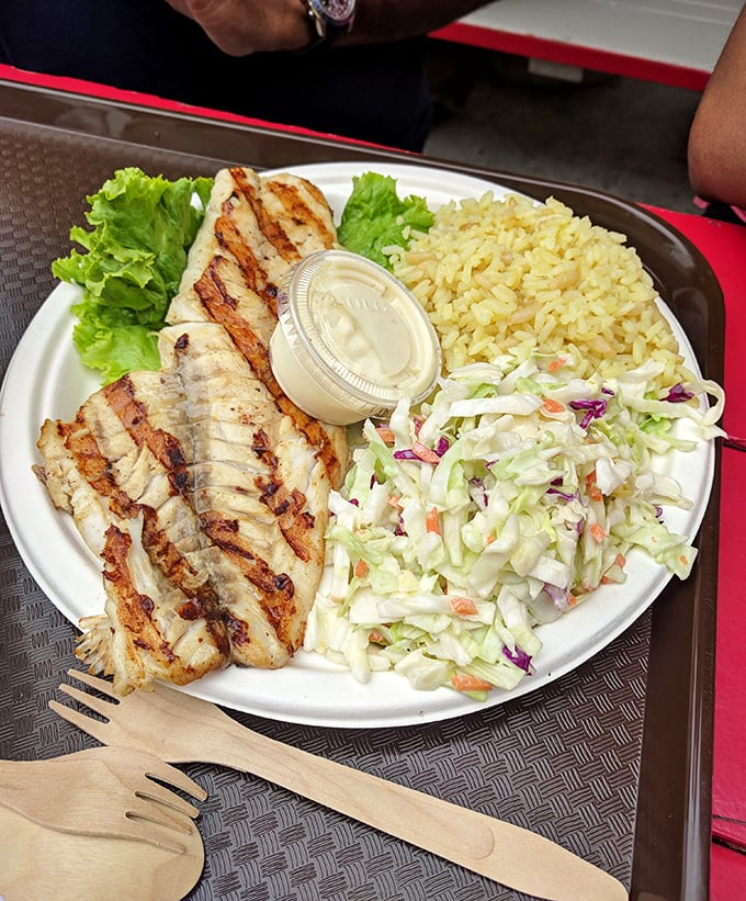 Grilled mahi-mahi that whispers of open flames and ocean breezes, served with the holy trinity of seafood sides: rice, slaw, and a squeeze of California sunshine.