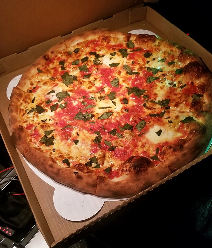 A classic Margherita that would make Naples proud—bright tomato sauce, melted mozzarella, and fresh basil in perfect harmony.